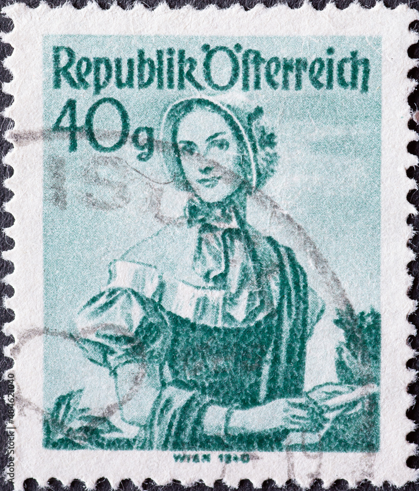 Austria - circa 1949: a postage stamp from Austria, showing a woman in ...