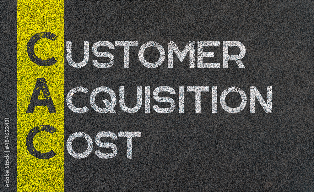 Customer acquisition cost (CAC) written over road marking yellow paint ...