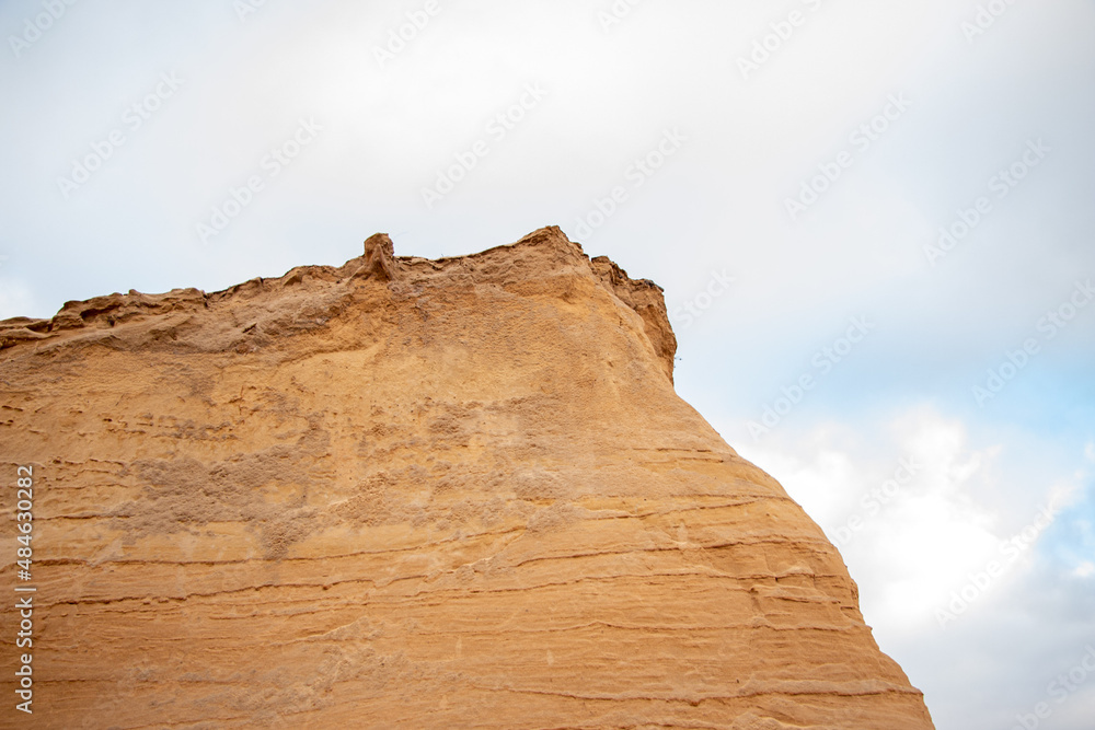 Textural sand, with relief surface, multi-colored layers and different ...