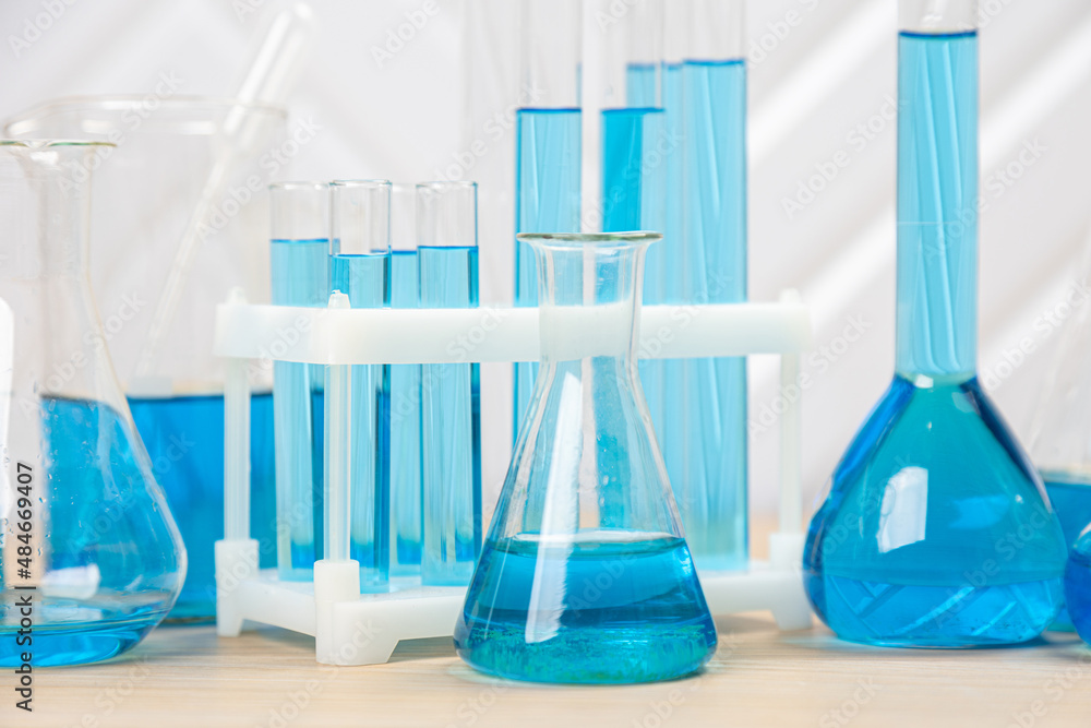 Laboratory glassware with test tubes. flasks, dropper, petri dishes ...