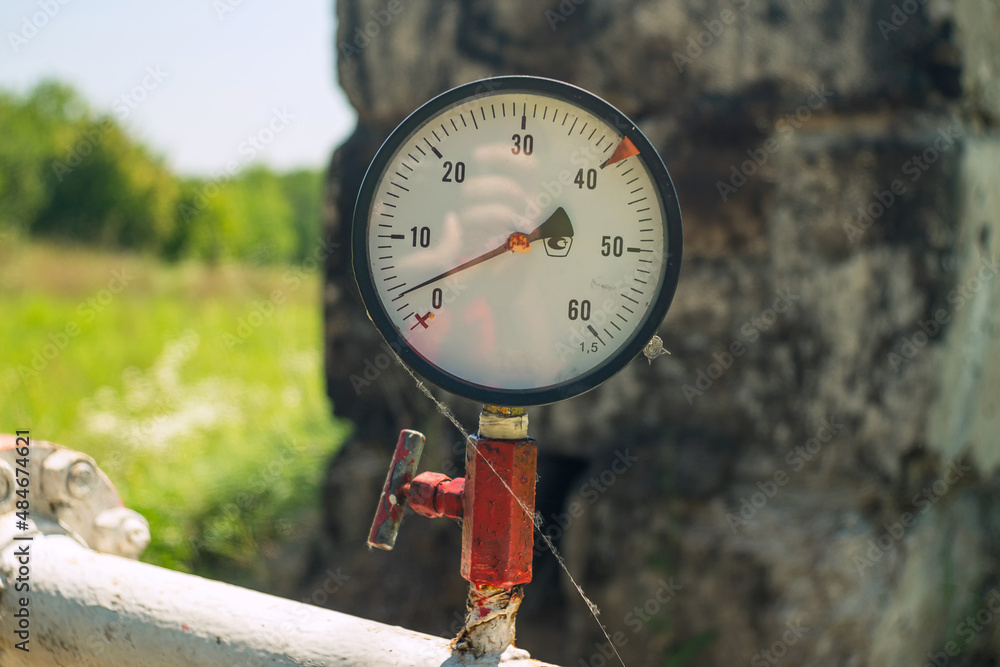 Pressure gauge on the pipe through which the oil is pumped. Extraction ...