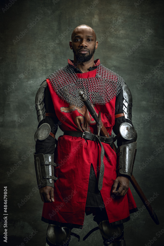 Vintage style portrait of brutal dark skinned man, medieval warrior or ...