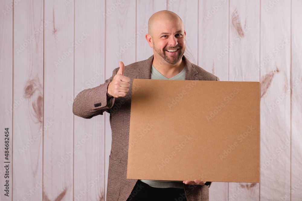 business man holding up a cardboard sign blank making gestures and ...