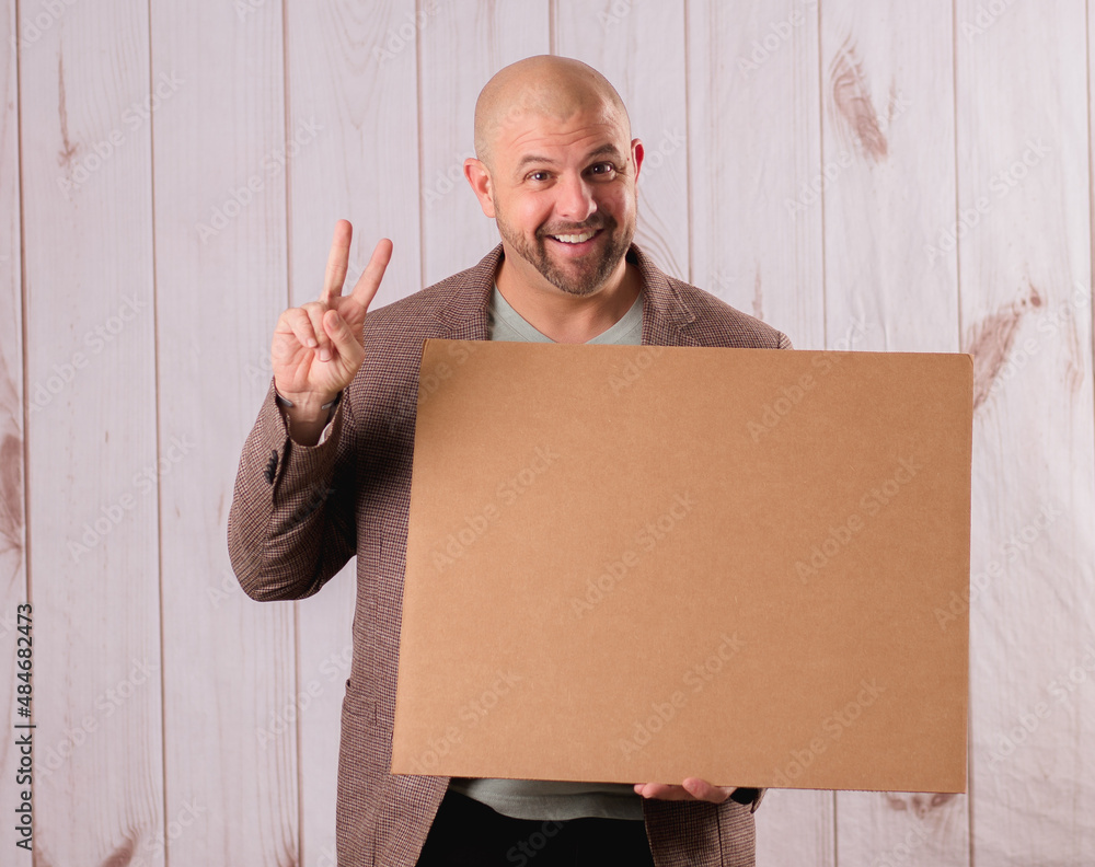 business man holding up a cardboard sign blank making gestures and ...