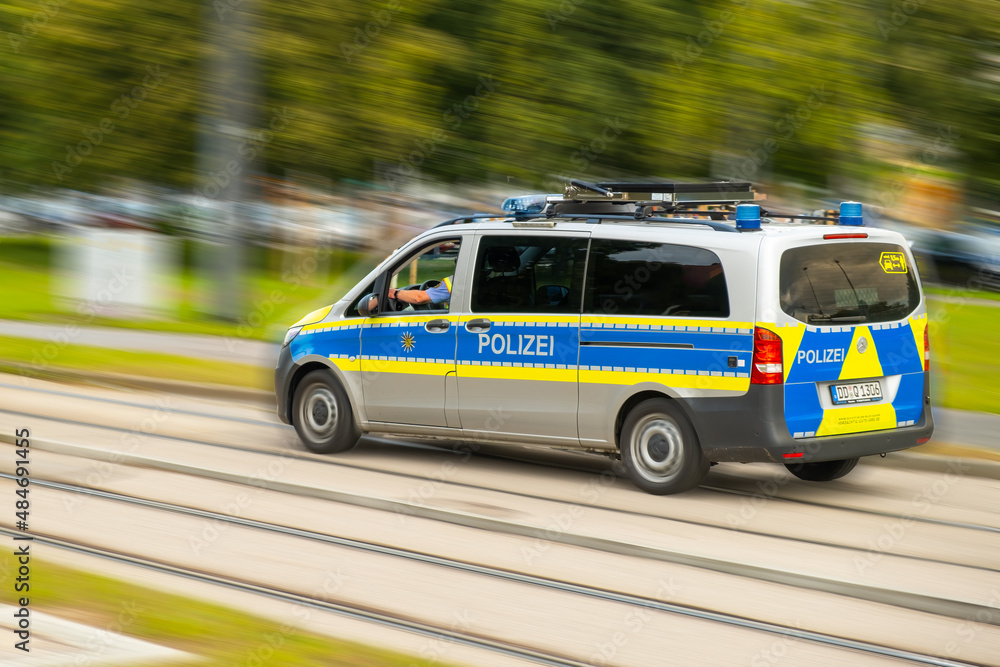 German police car with letters Polizei drives fast on call on the ...