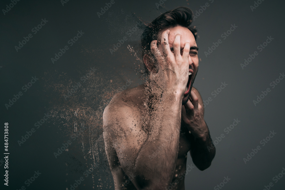 Screaming frustrated man exploding and disintegrating into particles ...
