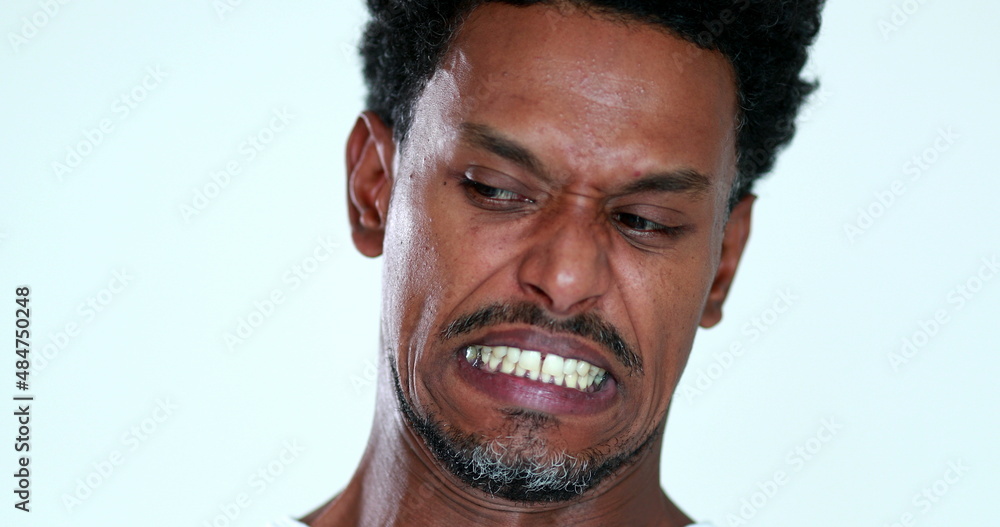 Person feeling disgust emotion portrait face close-up. African black ...