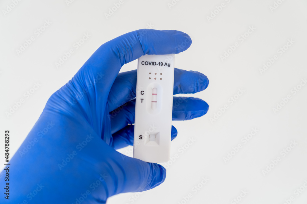 Medical nurse hand in medical gloves holding Covid-19 rapid antigen ...