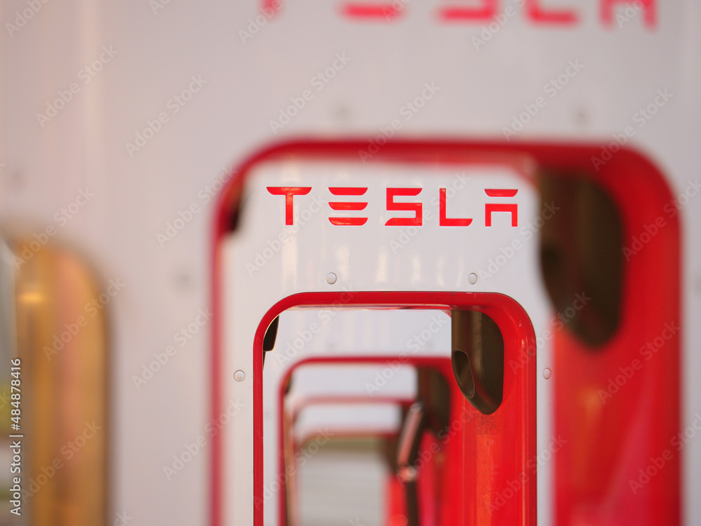 LOS ANGELES, CA - December 2021: TESLA logo closeup on super charger ...