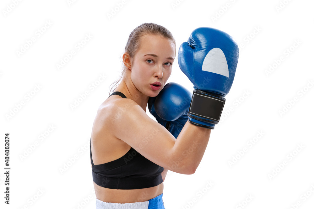 Portrait of young beautiful girl, professional boxer in boxing shorts ...