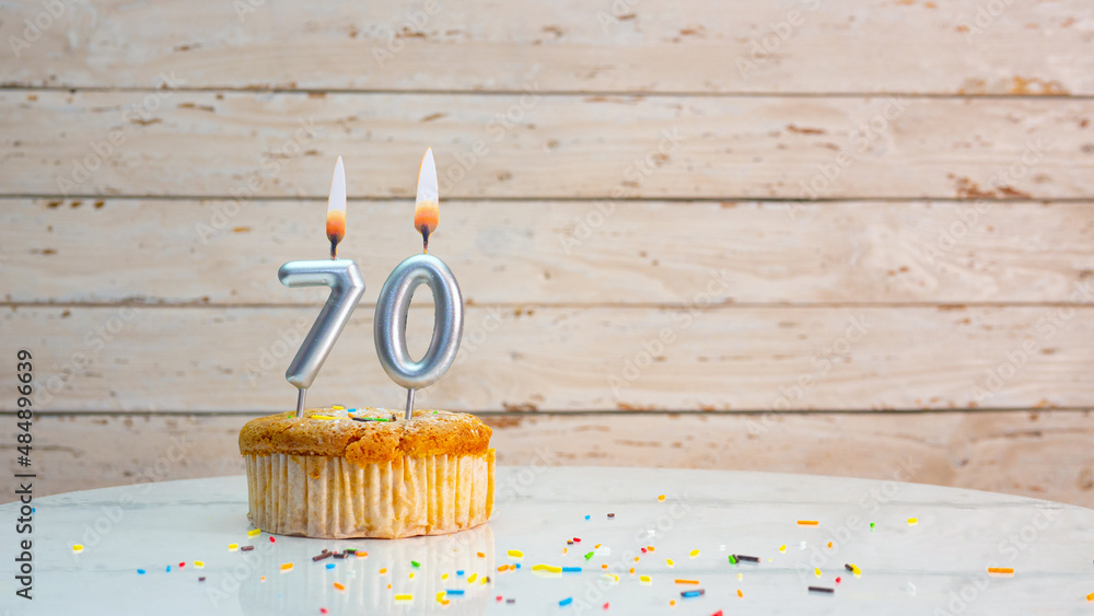 Happy 70th birthday greetings from silver numbers on white boards ...