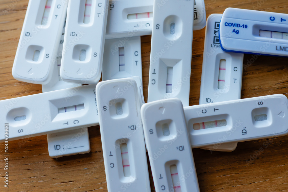 Pile of positive Covid-19 rapid home lateral flow antigen tests Stock ...