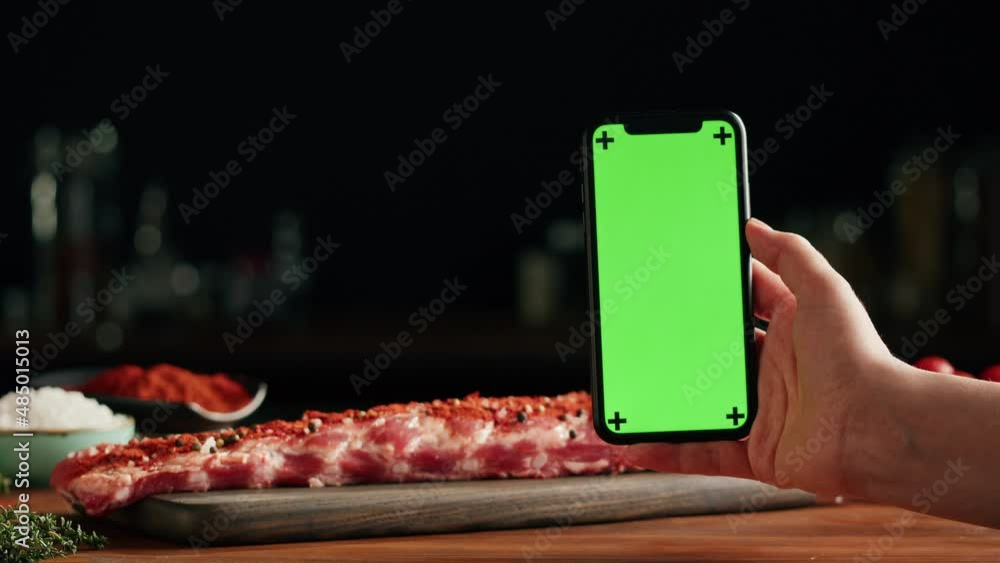 Woman chef cooking ribs close-up. Professinal cheif preparing pork meat ...
