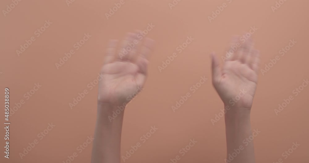 Close up of woman's hand make a gesture of waving greetings or wave ...