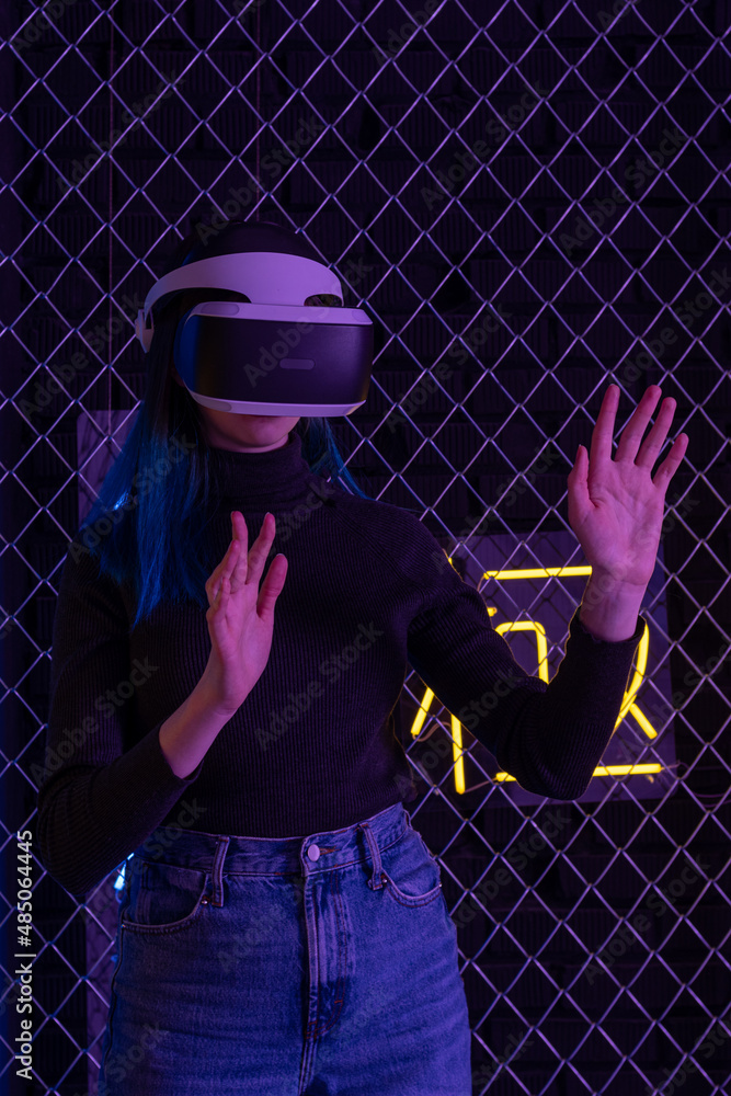 Teen girl using vr headset is in virtual reality cyberspace futuristic ...