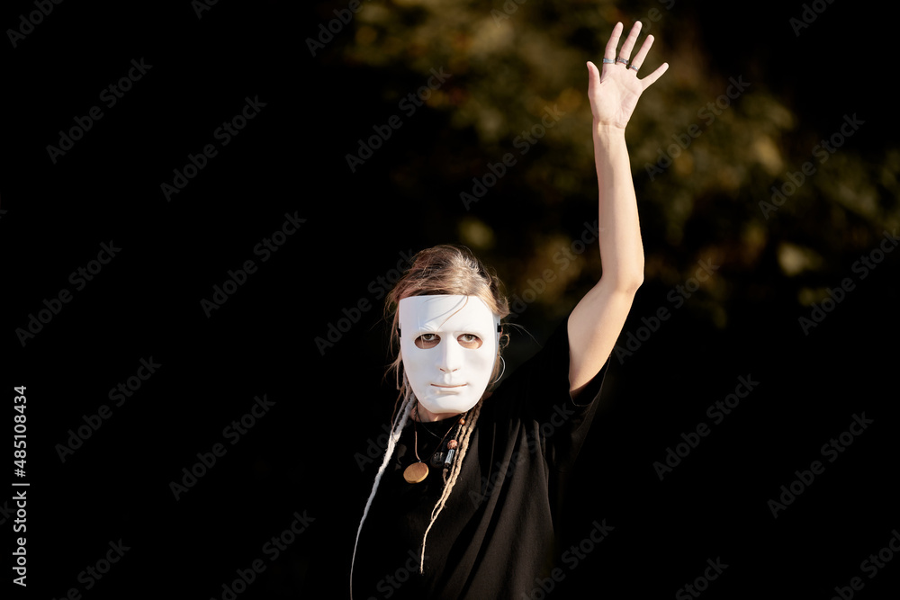 Woman acting in stage role in theater mask making smooth movements ...