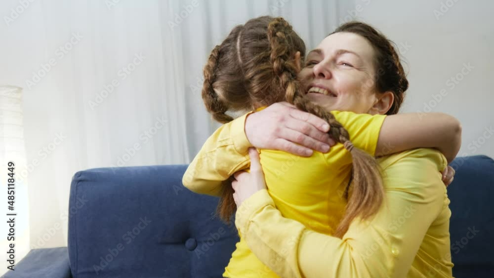 daughter hugs mom. happy family a lockdown stay home concept. mom and ...