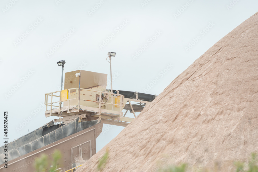 A stockpile of limestone mined in an above ground quarry. The beige ...