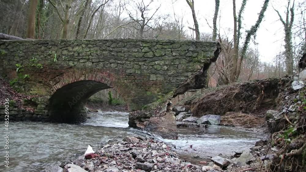 Damaged bridge shows broken bridge after heavy rainfall and extreme ...