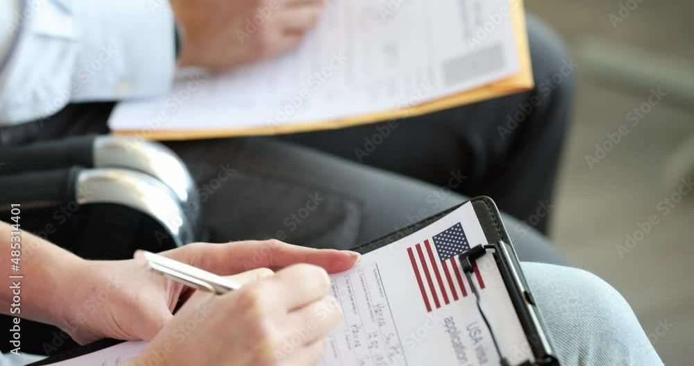 Group of people fill out US visa application form closeup Stock Video ...