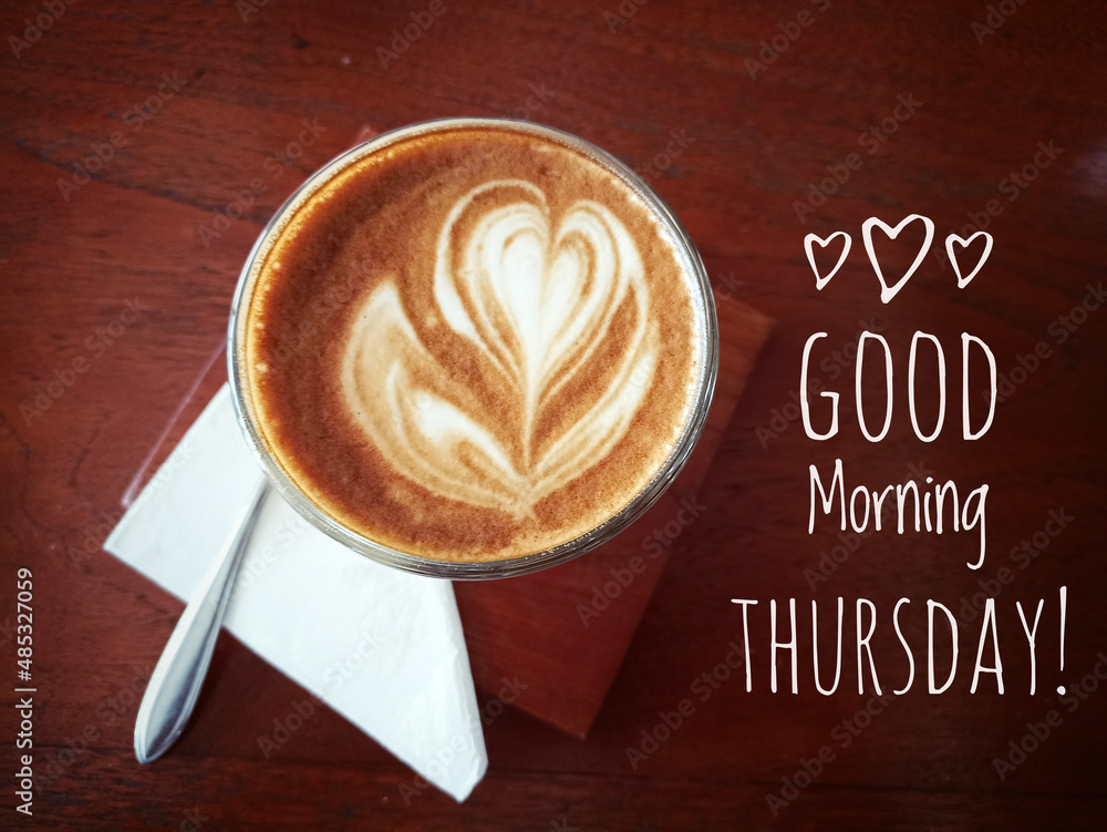 Thursday concept with morning coffee late in a cup on brown wooden ...