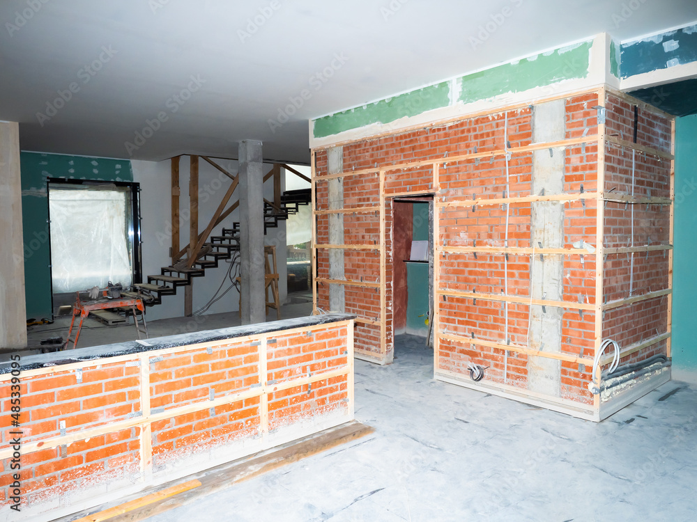 Construction concept. Finishing works in the room. Finishing of walls ...