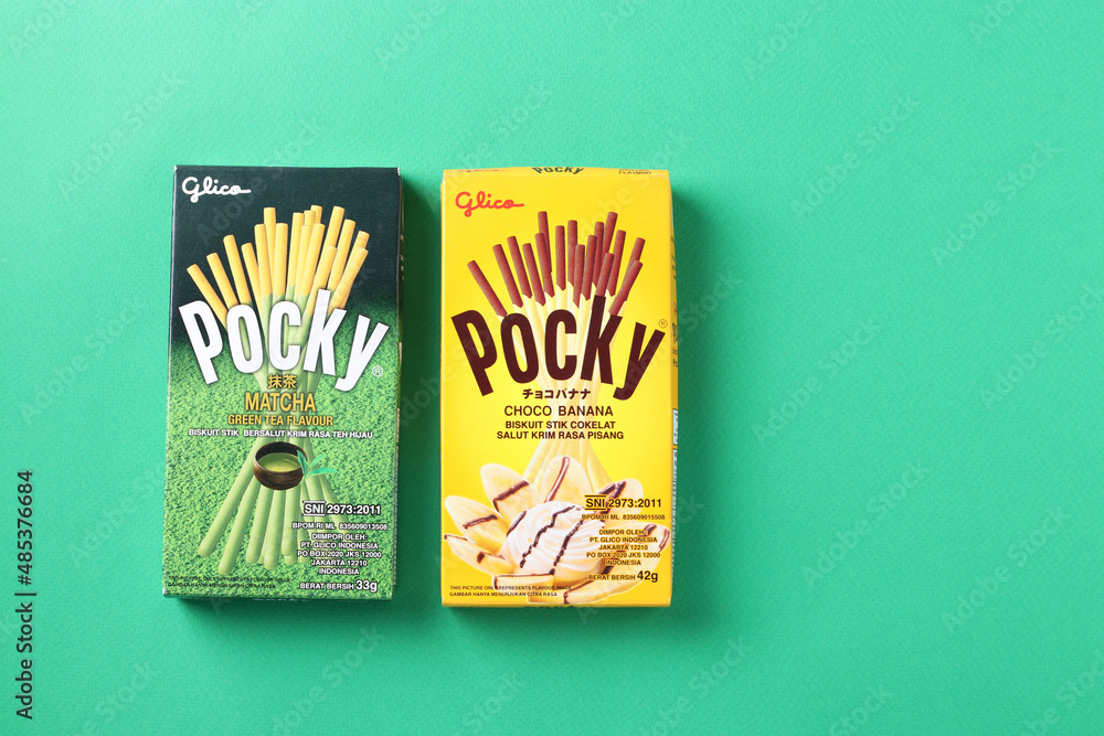 Pocky brand with banana and matcha sticks on green background, famous ...