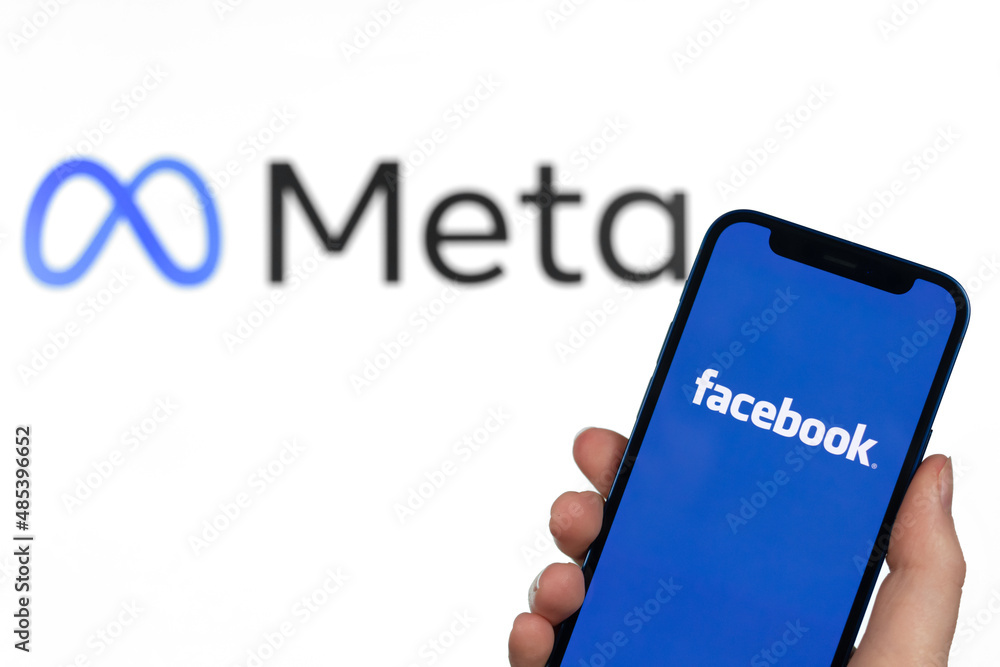 Facebook change name in Meta. Logo on mobile phone screen. Metaverse ...