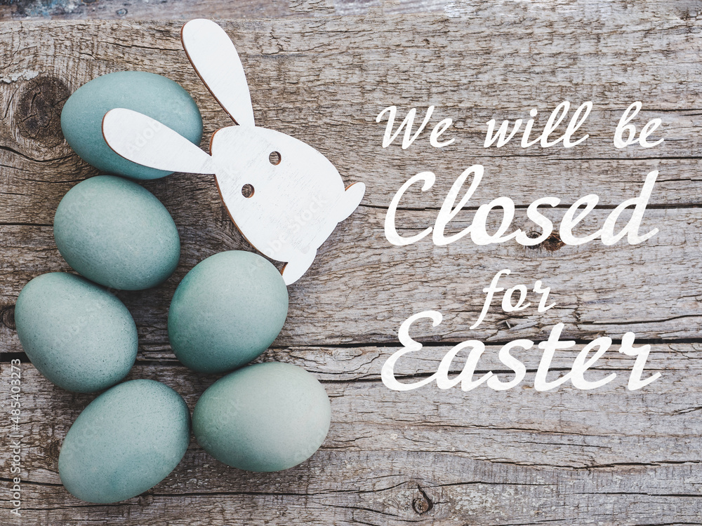 Signboard with the inscription We will be closed for Easter. Easter ...