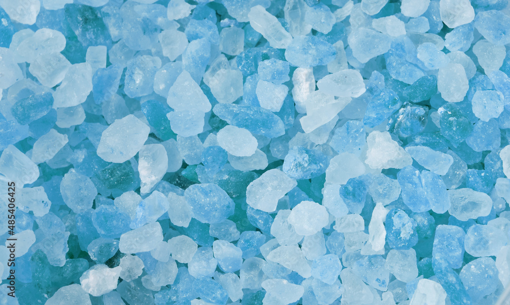 Blue salt crystals as background photo. Closeup blue ice stones lay on ... Blue salt crystals as background photo. Closeup blue ice stones lay on ...