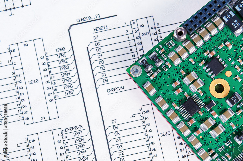 Electronic board on background of schematic circuit diagram. Concept ...