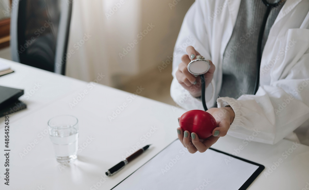 Woman doctor hands holding stethoscope to checking red heart model,Good ...