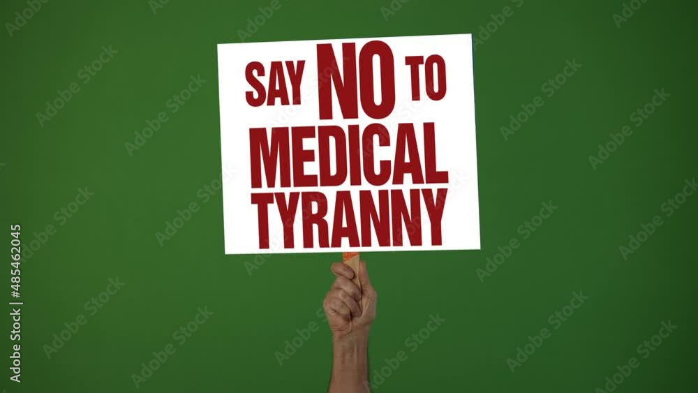 Hand holding sign banner with text Say No To Medical Tyranny in protest ...