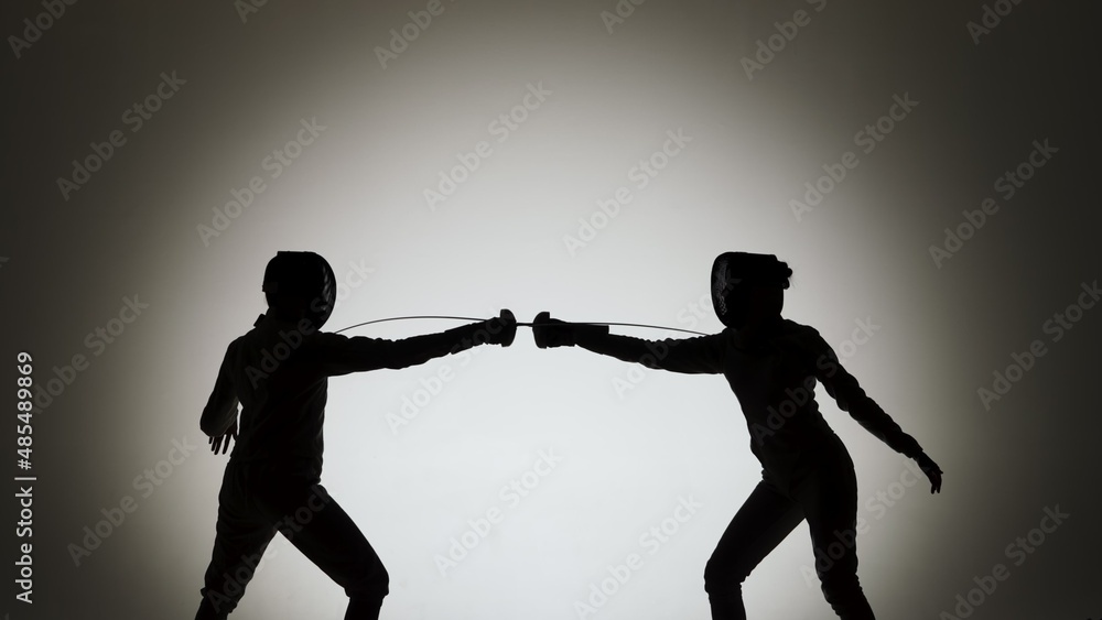 Black silhouettes of two female swordsmen fighting a duel. Athletes ...