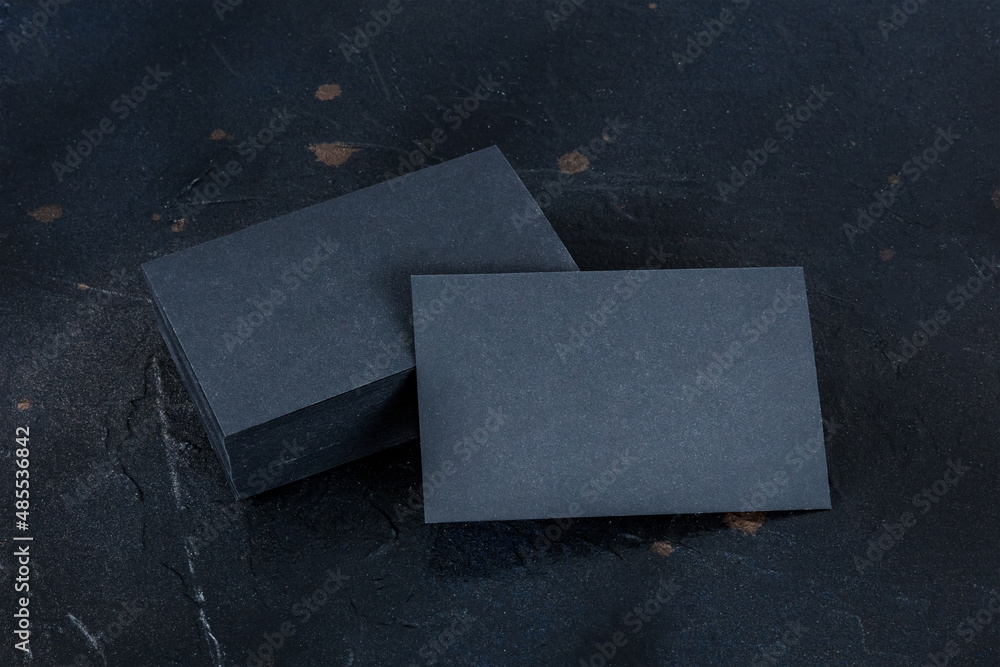 Black business card mockup on a dark background, a template for design ...