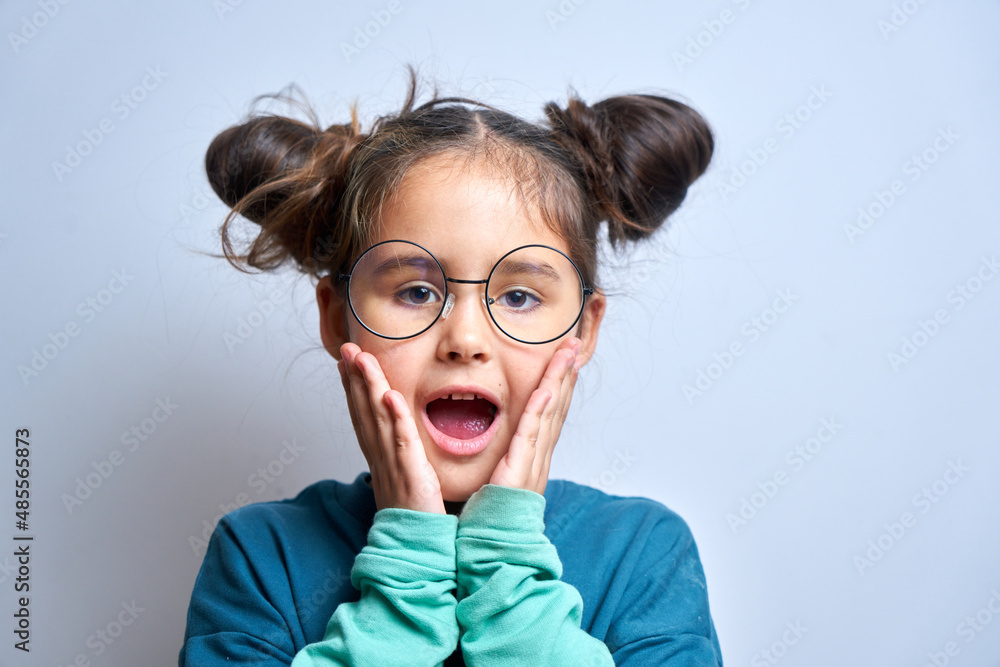 Funny little girl with shocked face and surprised open mouth closeup ...