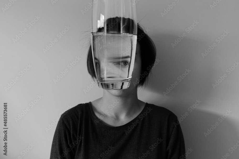 Girl looking through the glass. Conceptual photography in black and ...
