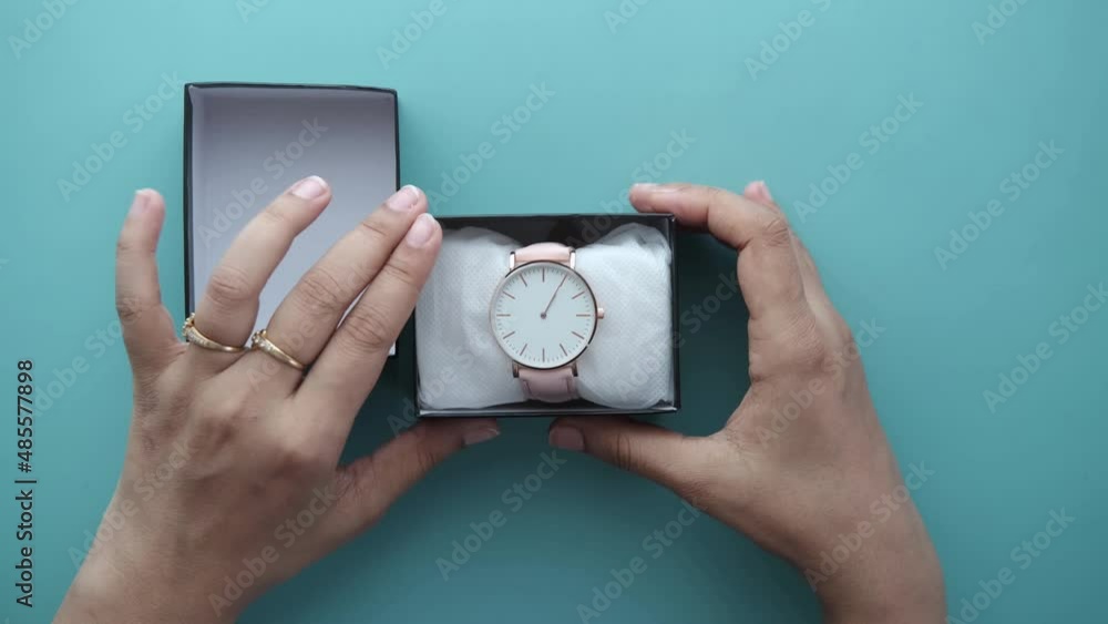 women hand open a box and checking her watch Stock Video | Adobe Stock