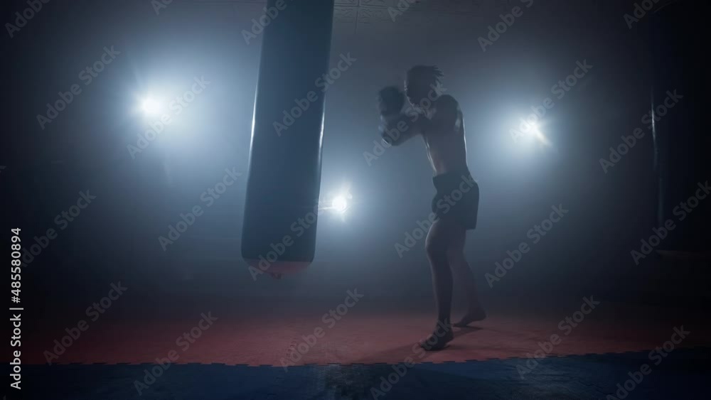 Video Stock Sportsman boxing in smoky studio. Kickboxing. Silhouette of ...