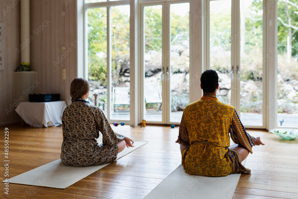 Rear view of people meditating Stock Photo | Adobe Stock