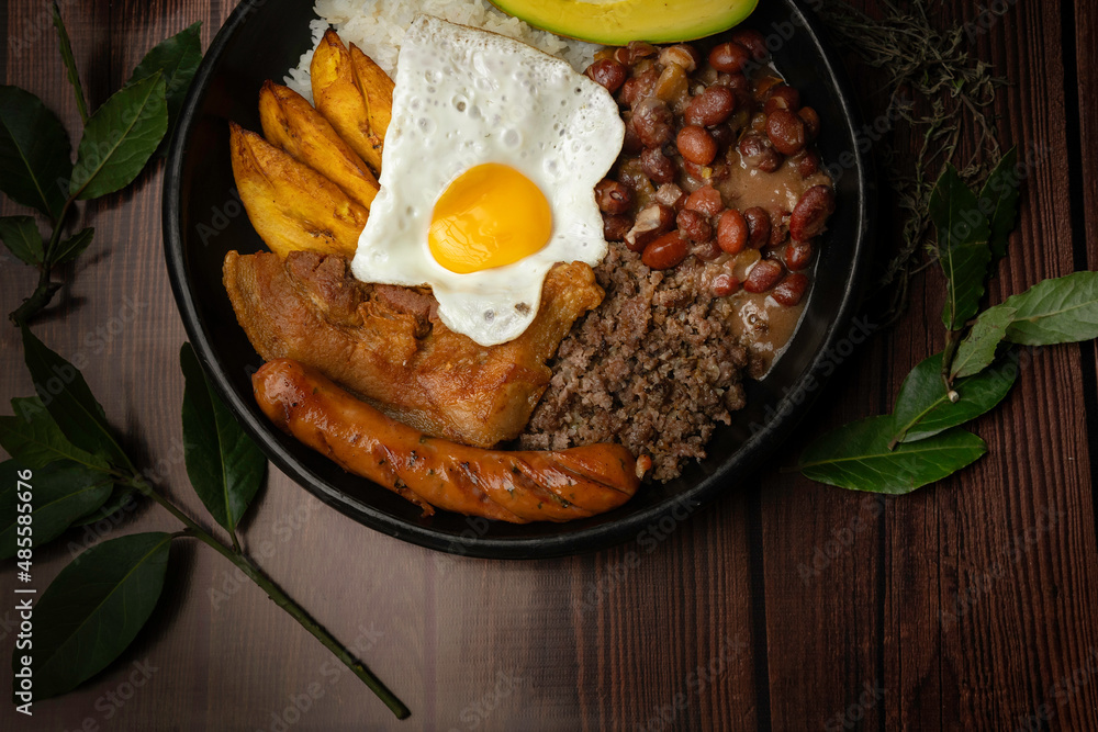tray paisa aerial view, typical Colombian food, with beans, eggs, rice ...