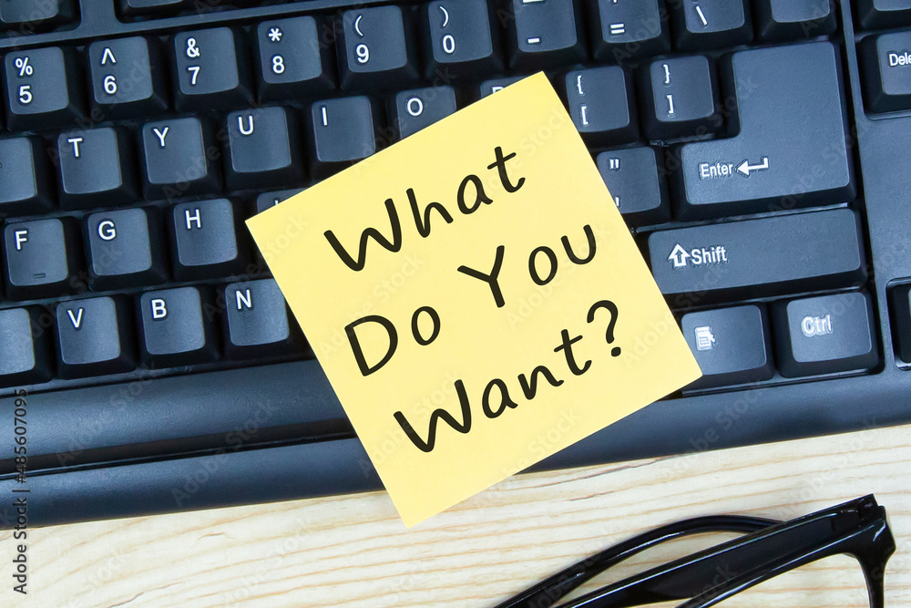 Text What Do You Want on sticky note on top of keyboard, business ...