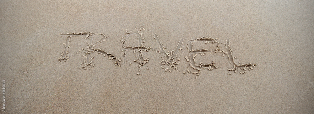 Write word "TRAVEL" in cursive on sand with open tourism concept. Stock ...