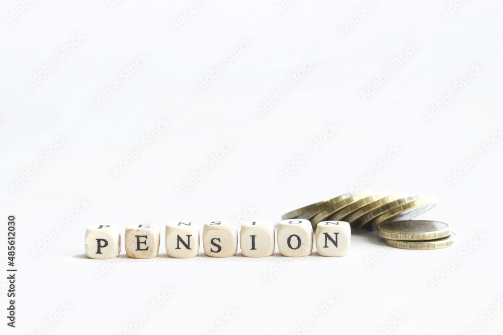 Word pension next to a lot of small coins. The concept of calculating ...