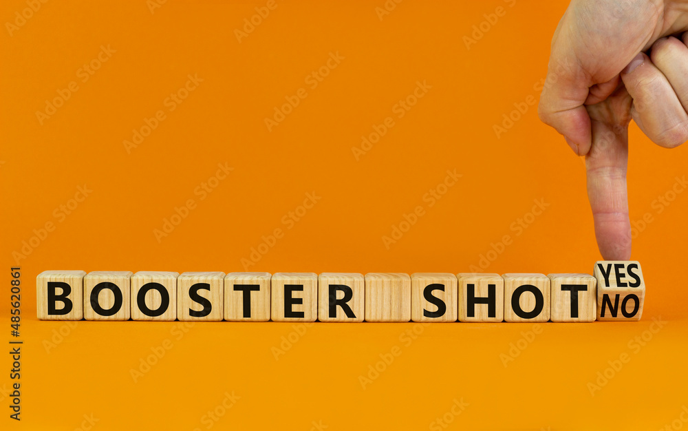 Covid-19 booster vaccine shot yes or no symbol. Doctor turns cubes and ...