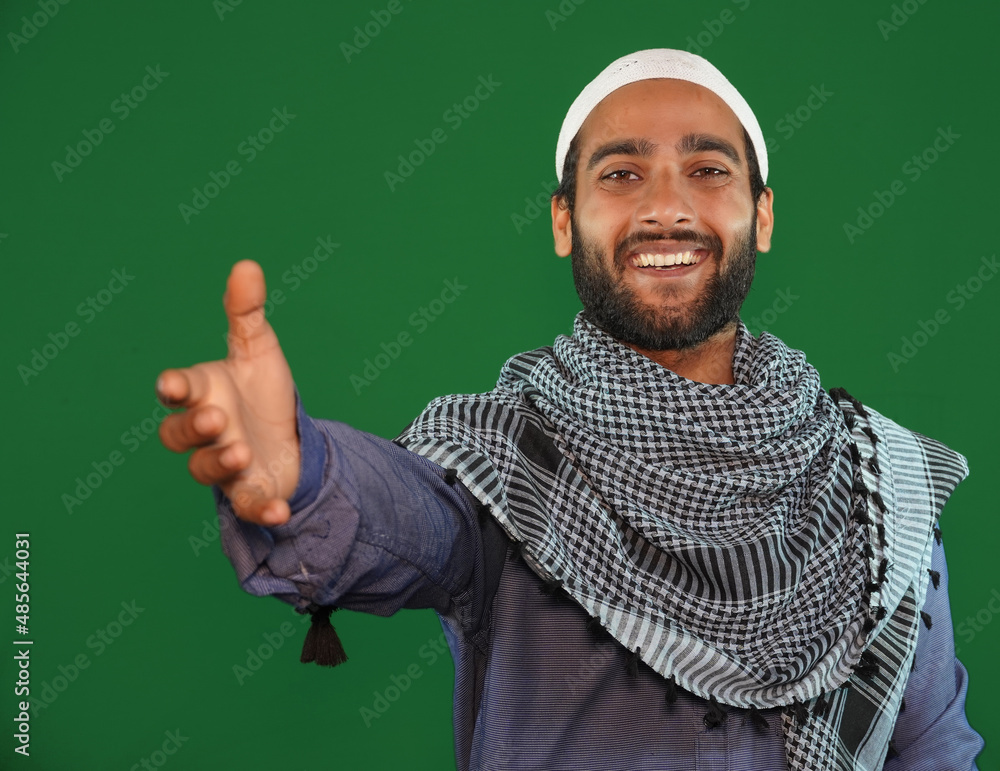 muslim boy hiving his hand for help hand shake on Green screen ...