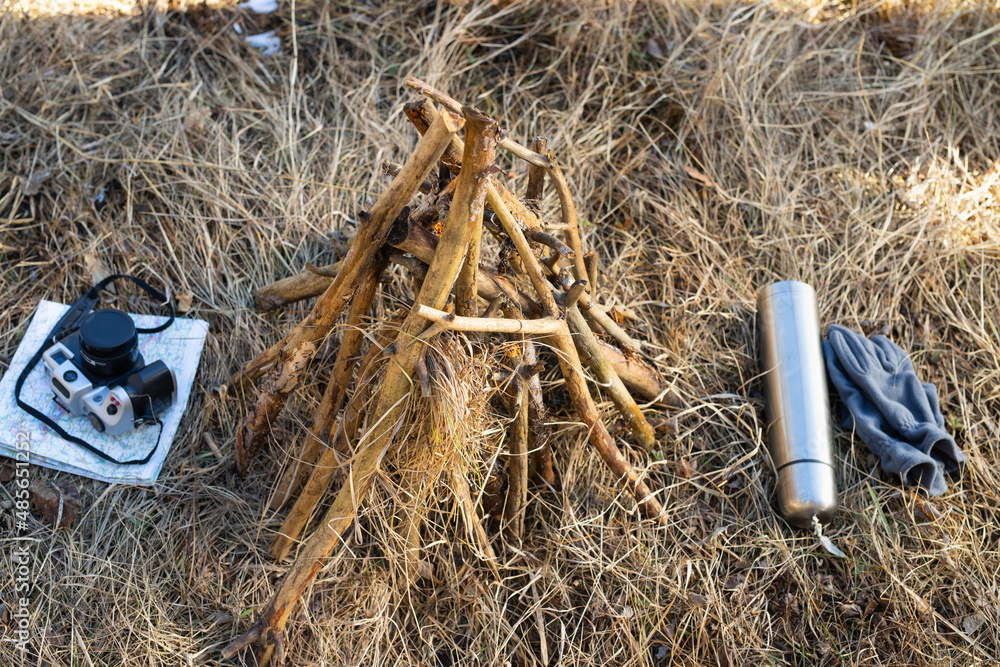 Close up photo of a bonfire outdoors in the forest with a camera and ...