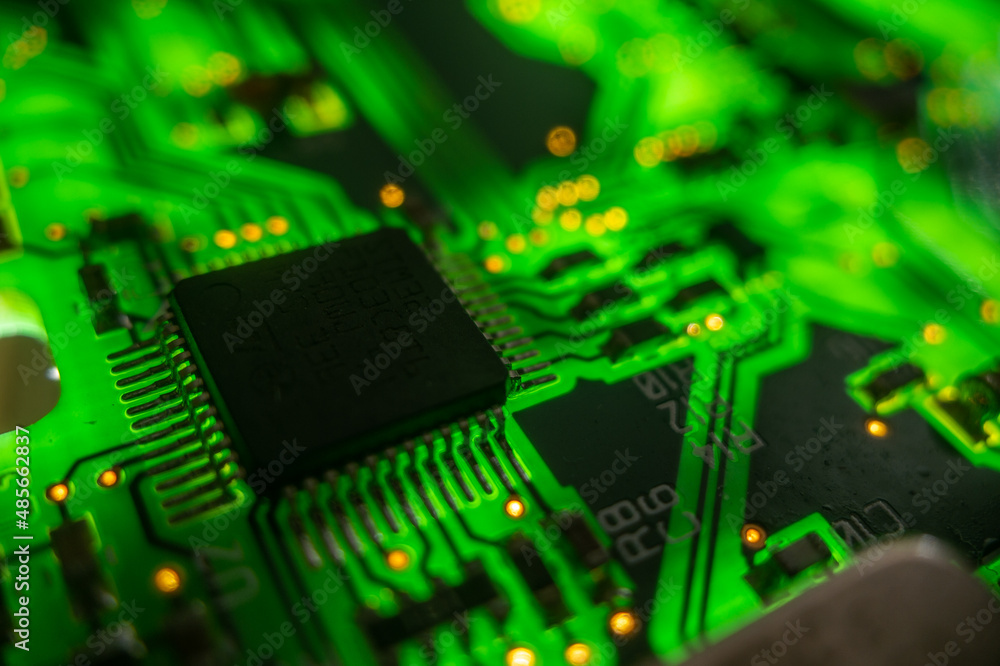 Detail of a microprocessor, resistors and capacitors soldered to a ... Detail of a microprocessor, resistors and capacitors soldered to a ...