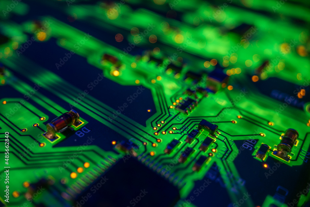 Detail of a microprocessor, resistors and capacitors soldered to a ...