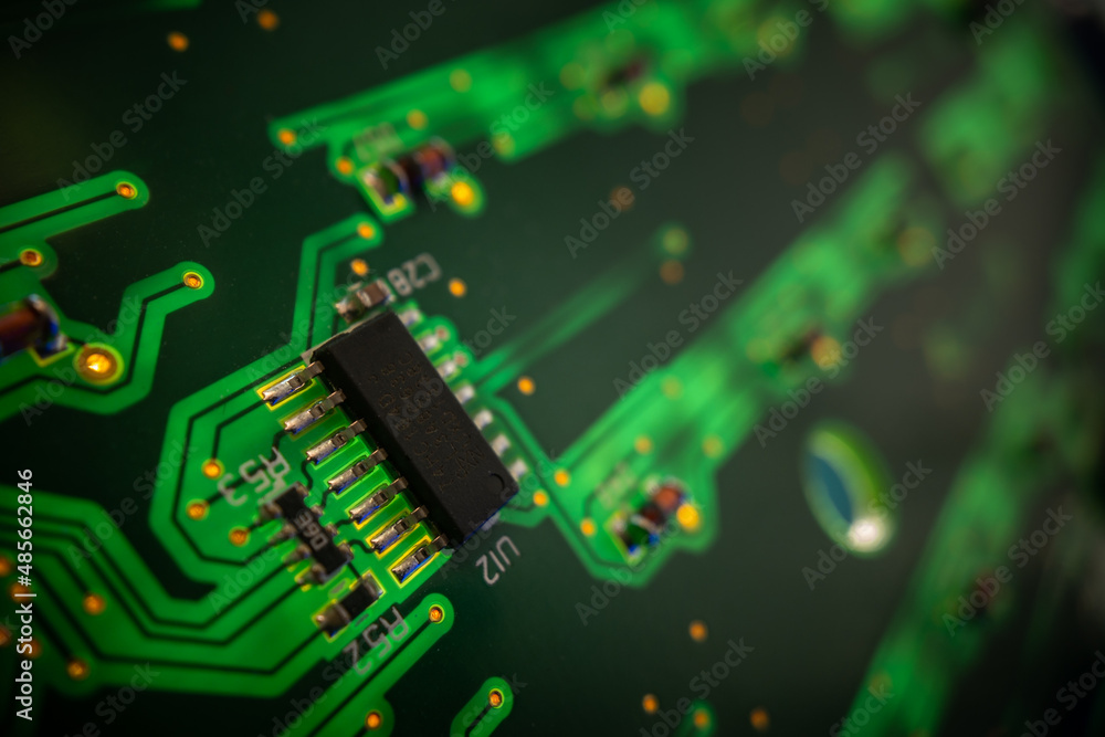 Detail of a microprocessor, resistors and capacitors soldered to a ...